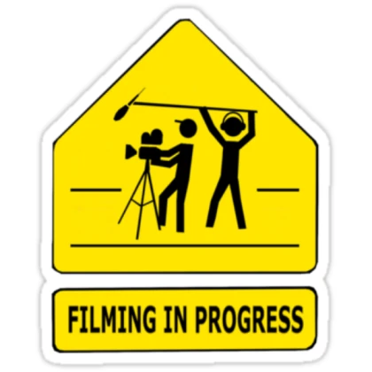 Filming in progress sign